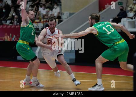 Australia's Samson James Froling, center, shoots against Lebanon's ...
