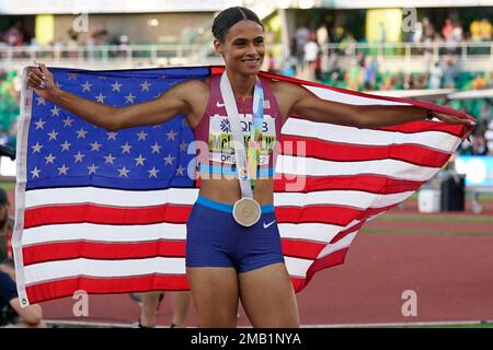 Gold medalist Sydney McLaughlin, of the United States, background ...