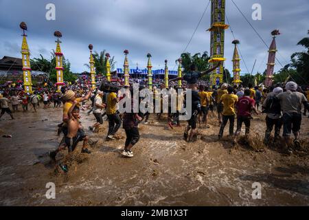 Pnar, or Jaintia, tribals carry 'Rongs' or chariots and dance in muddy ...