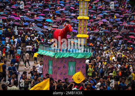Pnar, or Jaintia, tribals carry 'Rongs' or chariots and dance in muddy ...