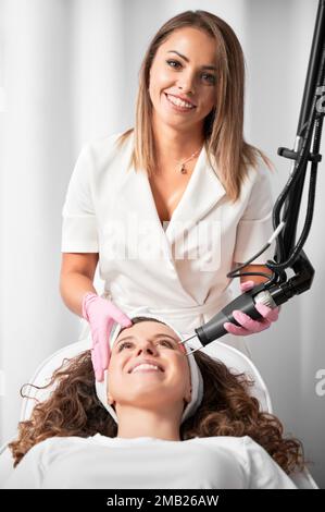 Laser photorejuvenation and carbon peeling of face for woman. Black ...