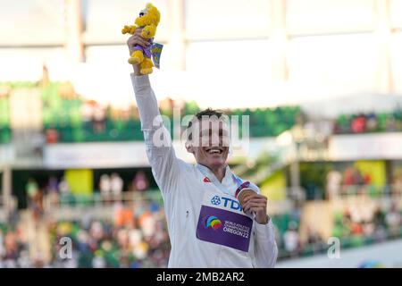 Gold medalist Jake Wightman, of Britain, poses on the podium after the ...
