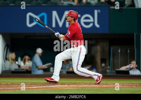 Texas Rangers' Corey Seager follows through on a swing during a ...