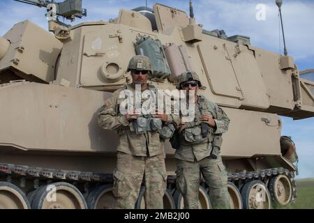 1st Lt. John Christiansen and Staff Sgt. Jerney Topham, artillery Soldiers with Bravo Battery ...