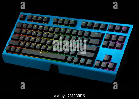 Blue computer keyboard with rgb colors isolated on black background ...