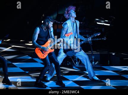 Machine Gun Kelly, left, and guitarist Justin Lyons perform at ...