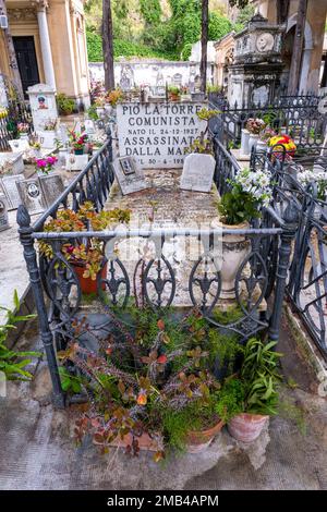 Graves, sculptures, photos and flowers in the cemetery Cimitero dei ...