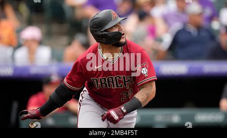Arizona Diamondbacks catcher Jose Herrera (11) and relief pitcher Kyle ...