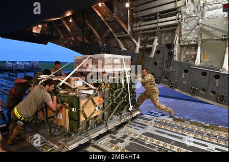 Loadmasters from the 155th Airlift Squadron, load cargo during the ...