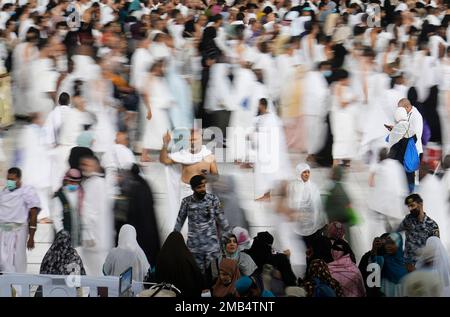 In this photo taken with low shutter speed, Muslim pilgrims ...