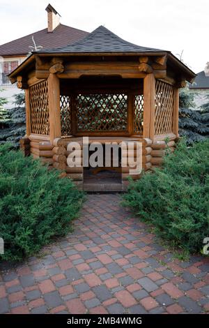 Camping gazebo with barbecue table and bench for outdoor picnic in ...