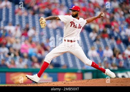 Philadelphia Phillies' Cristopher Sanchez, third from left, hands the ...