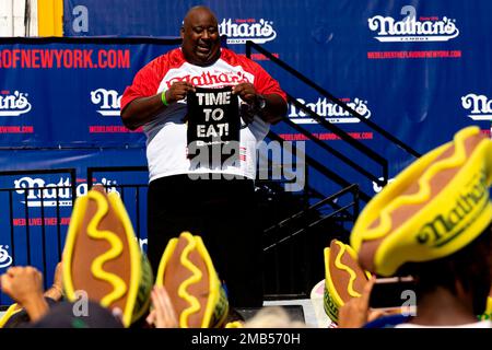 Competitive eater Eric "Badlands" Booker speaks at a weigh-in before ...