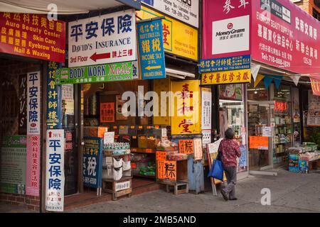Street covered by Oriental signs in Flushing neighborhood, Queens, New ...