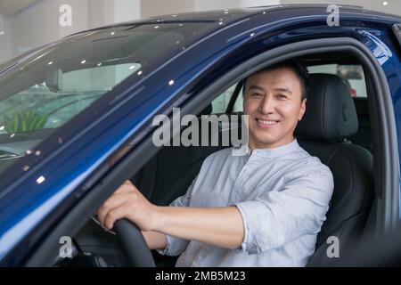 The old man test drive car Stock Photo - Alamy