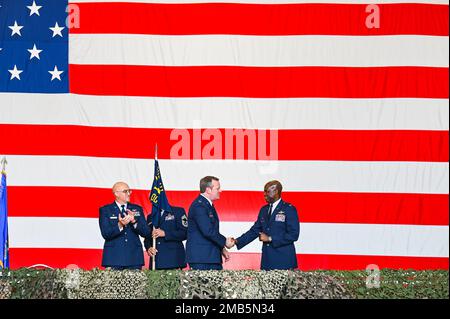 U.S. Air Force Col. Sheldon Wilson presents a retirement certificate to ...