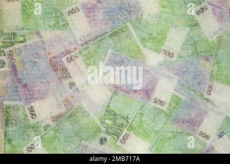 Blurred photo of one hundred and five hundred euros are defrosted in ...
