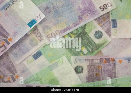 Blurred photo of one hundred and five hundred euros are defrosted in ...