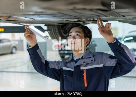 Repair shop mechanics researchers Stock Photo - Alamy