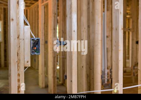 Electrical socket boxes inside frame house with basic electrical wiring ...
