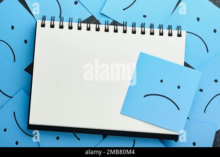 sad face on blue sticker,. High quality photo Stock Photo - Alamy
