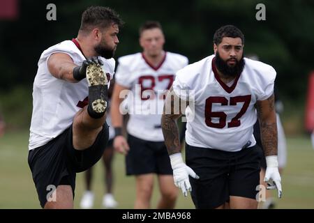 Washington offensive lineman Samuel Cosmi, center, is seen during an ...