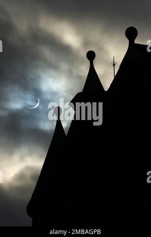 A crescent sun is seen during solar eclipse in Jammu, India, Sunday ...