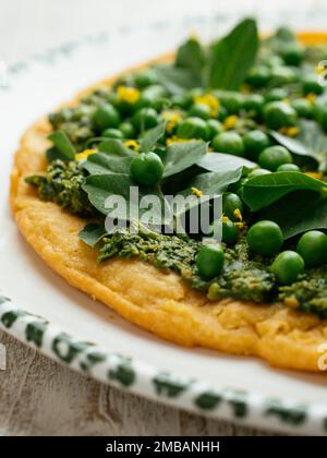 Home made vegan socca with mustard green pesto, peas and pea tendrils ...