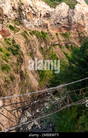 old suspension bridge over the chasm Stock Photo - Alamy
