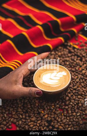 Girl in Cafe holding cup of hot coffee in hand, smiling Stock Photo - Alamy