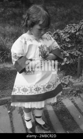 Unidentified child, standing outdoors. Genthe photograph collection ...