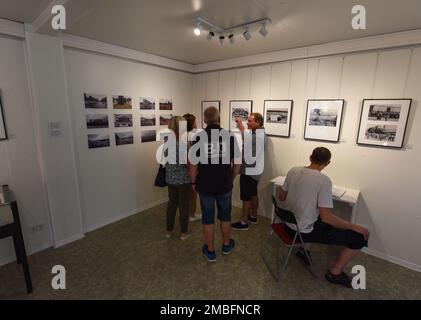 Attendees tour the 70 years of Ramstein Air Base Exhibit at the Docu ...