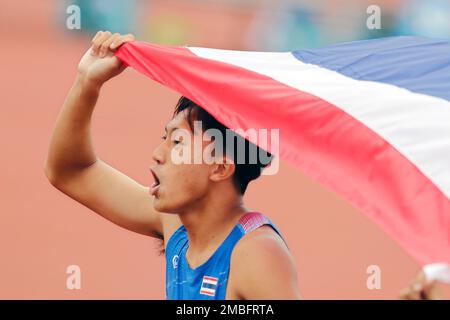 Gold medalist Puripol Boonson of Thailand celebrates with the national ...