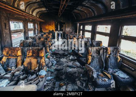 Train after fire. Burnt interior of passenger carriage. Consequences of ...