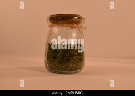 Jar of parsley shoot on a white background Stock Photo - Alamy