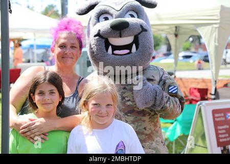 Rocky, the 3rd Infantry Division mascot, poses with a statue of himself ...