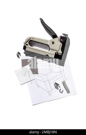 Iron construction stapler and staples isolated on a white background ...