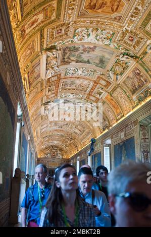 Visitors admire the artwork at the Vatican Museum Stock Photo - Alamy