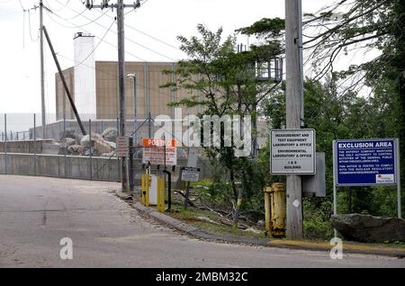 Warning signs are posted on the gate to a power substation Stock Photo ...
