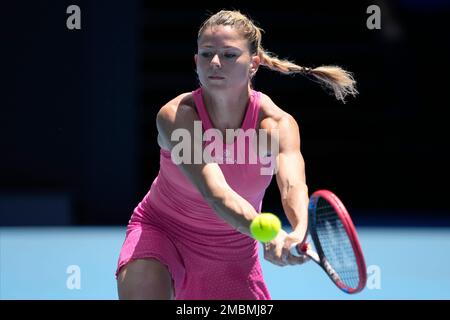 Camila Giorgi of Italy plays a backhand return to Ash Barty of ...