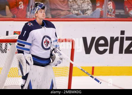 Winnipeg Jets goaltender Eric Comrie makes a glove save against the ...
