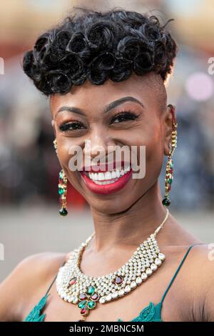 Miriam-Teak Lee poses for photographers upon arrival for the Britain ...