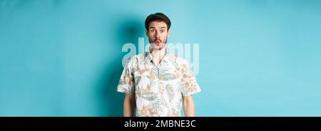 Summer holiday. Surprised tourist say wow and staring at camera ...