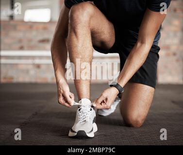 Lace, gym or hands of person with shoes at gym for training, exercise ...