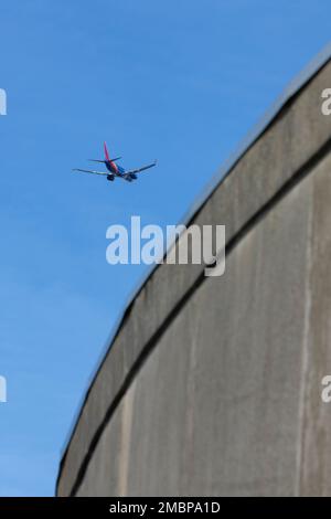 A Southwest Airlines plane takes off as the snow plows clear runways ...