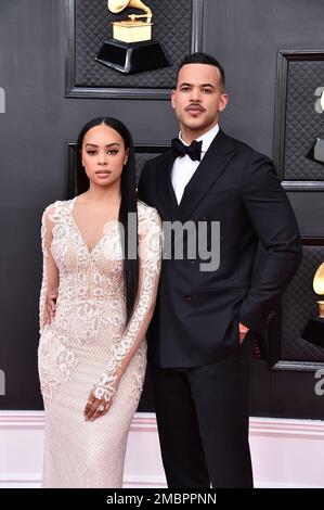 Kristy Sarah, left, and Desmond Scott arrive at the 64th Annual Grammy ...