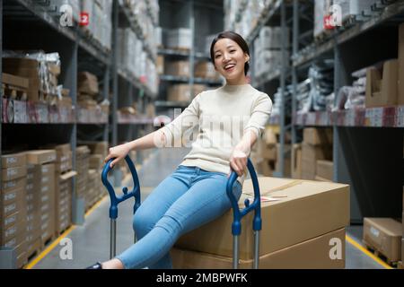 The young woman of choose and buy household items Stock Photo - Alamy