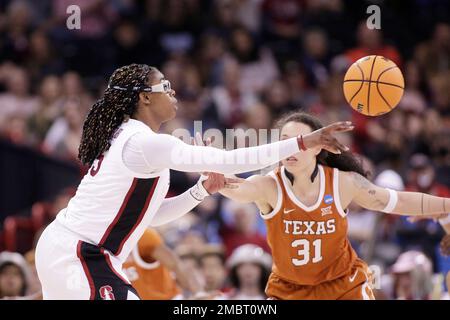Texas guard Audrey Warren passes the ball during a college basketball ...