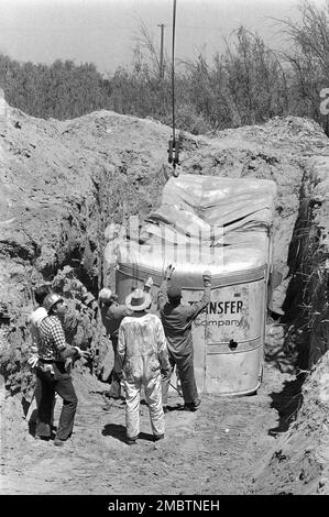 Officials remove a truck buried at a rock quarry in Livermore, Calif ...