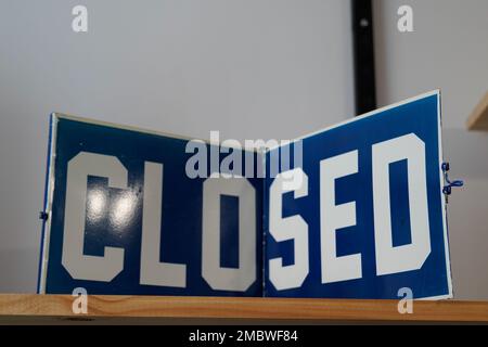 closed boutique text sign board door entrance on windows shop ...